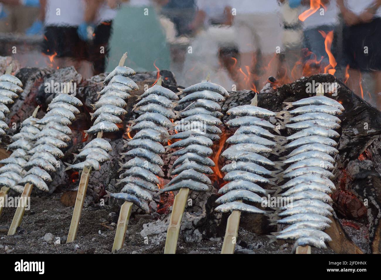 Sardines espetos grilled at fire outdoor, typical spanish food Stock ...