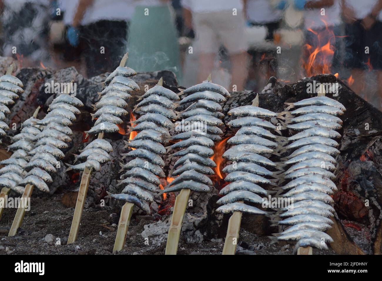 Popular barbecue with sardines espetos at grill, typical spanish food ...