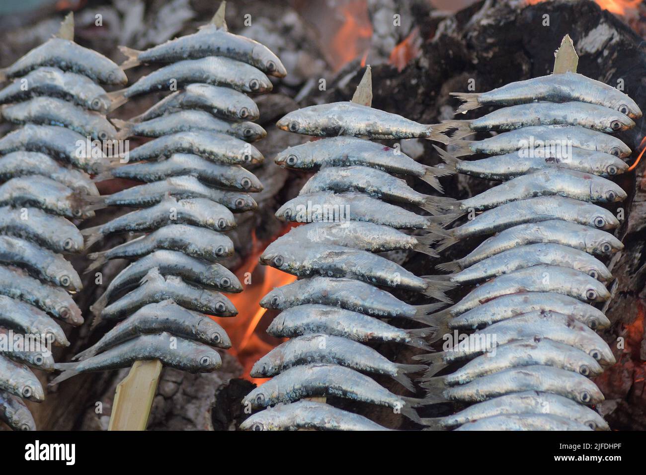 Sardines espetos skewers grilled fire hi-res stock photography and ...