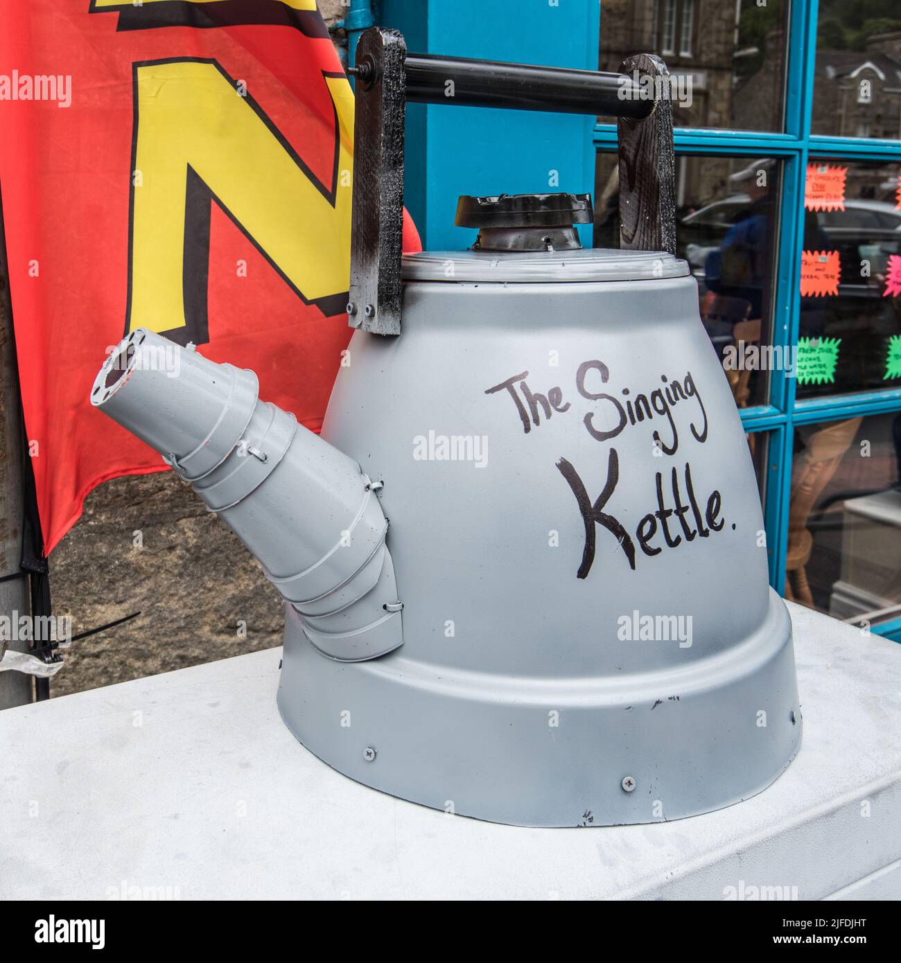 Outside The Singing Kettle cafe in the centre of Settle sits this ...