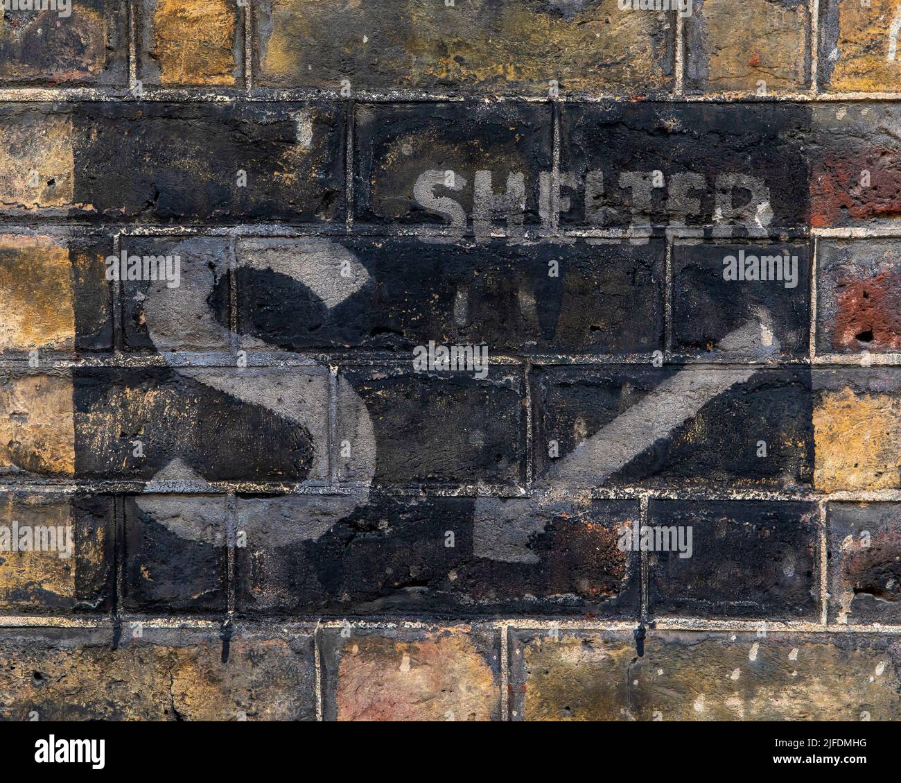 London, UK - April 20th 2022: Historic ghost signs on a street in ...