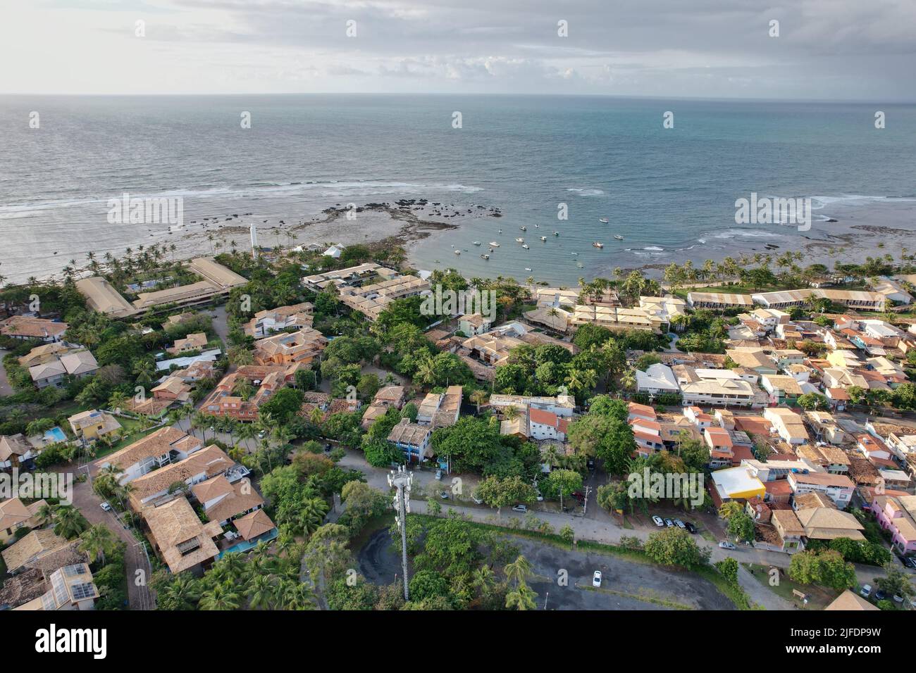 An aerial view of Praia do Forte village in Brazil in blue sky ...