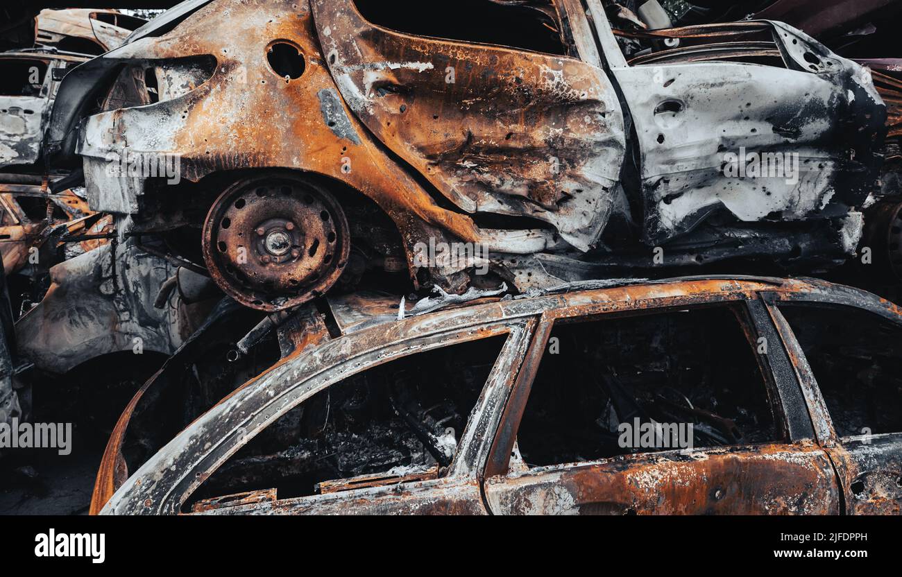 Cars destroyed amid Russia's attack on Ukraine are seen, after they ...