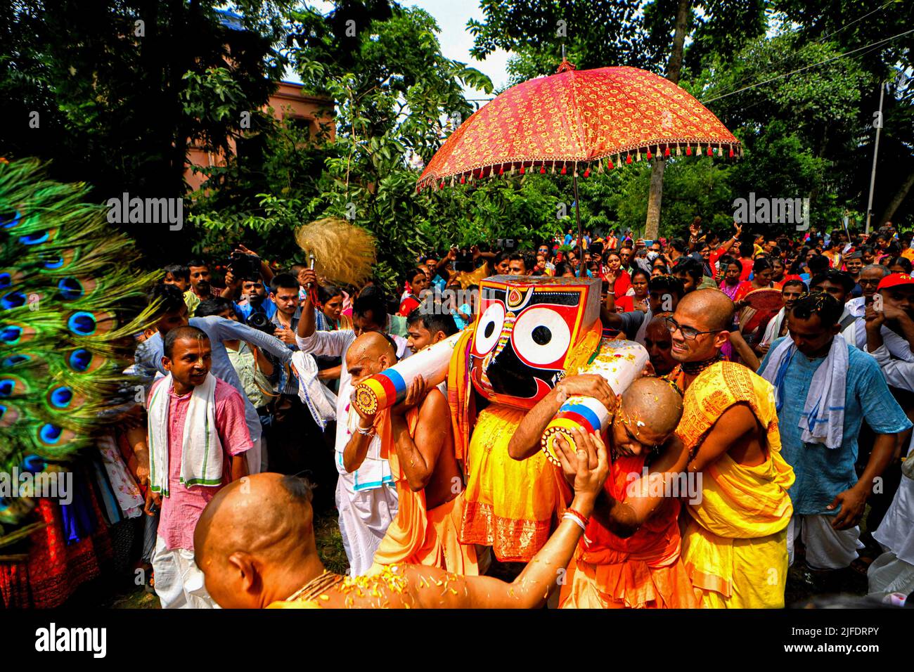 Carrying of lord jagannath at habibpur iskcon hi-res stock photography ...