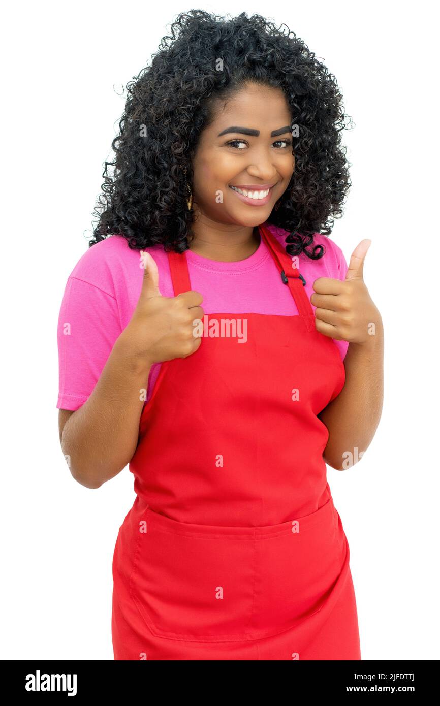 Laughing brazilian waitress with red apron showing thumbs up isolated ...