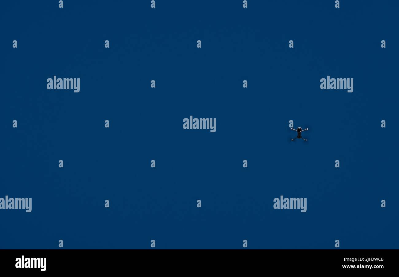 view of a drone in the blue sky - negative space - body copy Stock ...