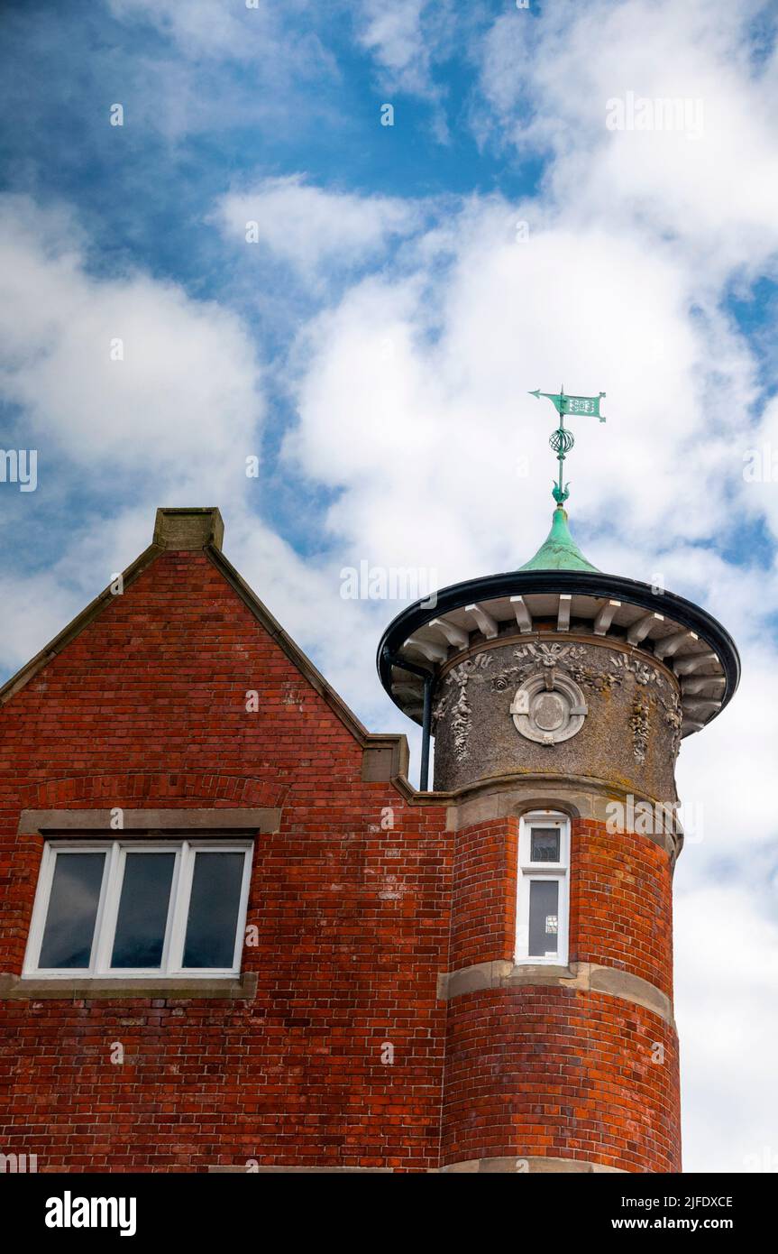 Portrush in Northern Ireland brick facade with a green verdigris wind ...