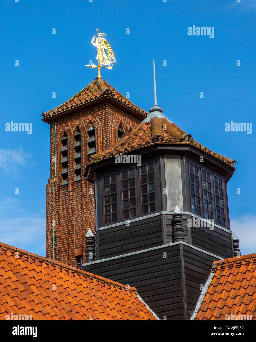 The golden weather vane depicting Archangel Gabriel on the church tower ...
