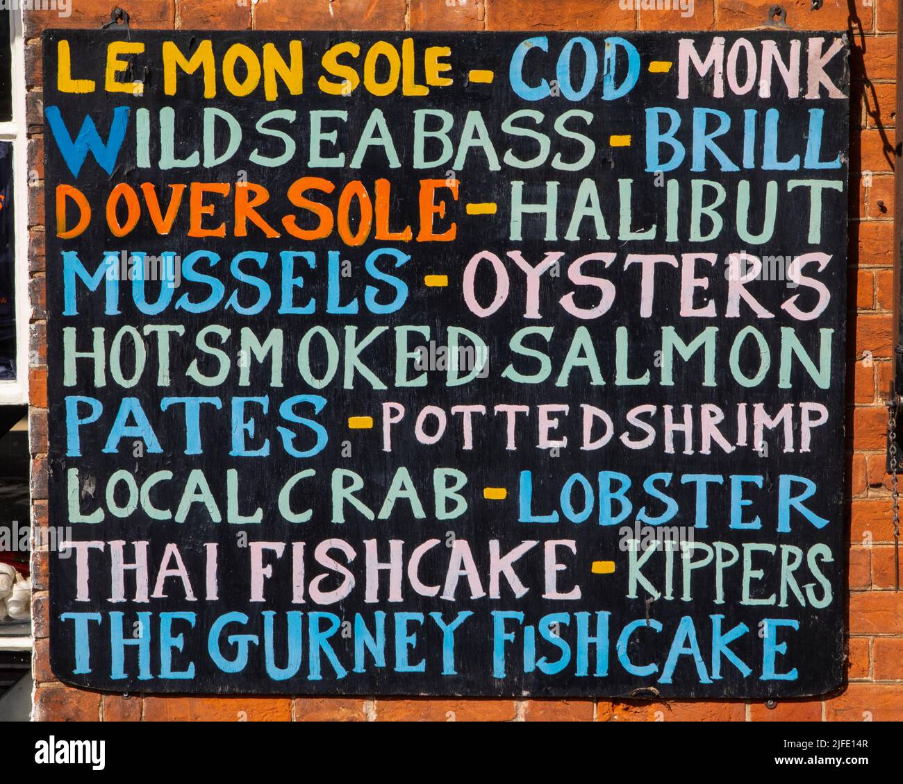 Close-up of a list of available fish and seafood on the exterior of a ...