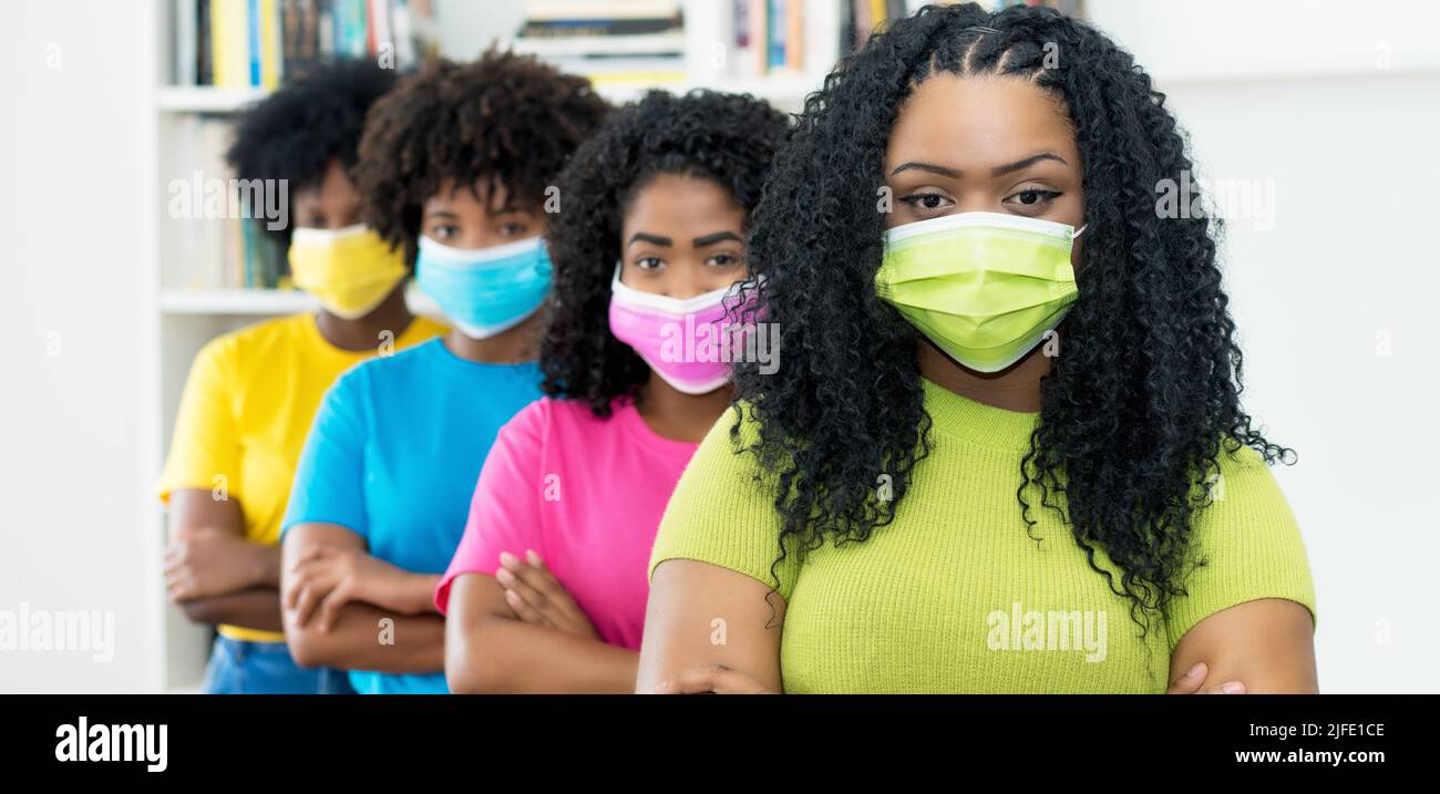 Group of beautiful african american female young adults with colorful ...