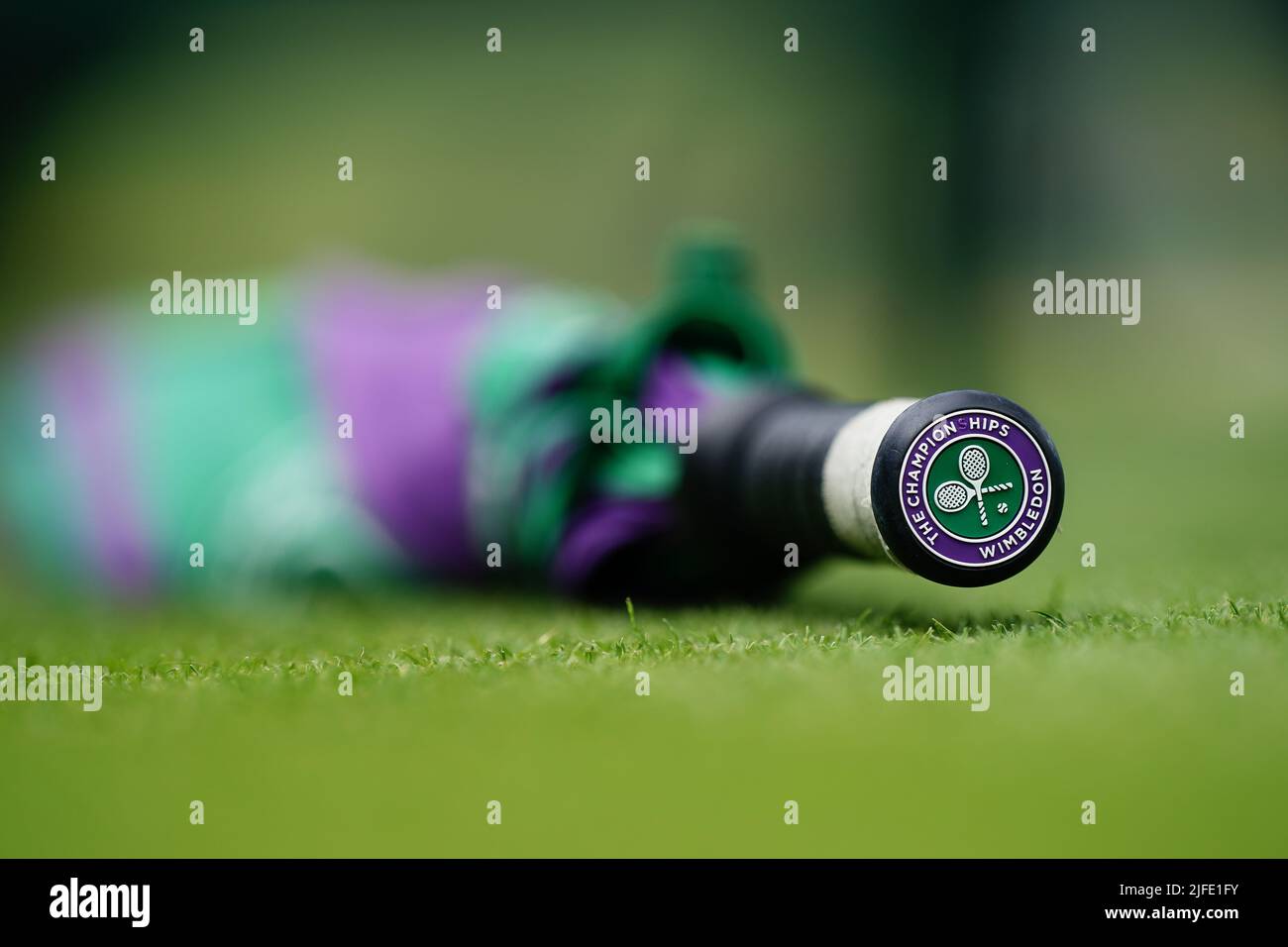 Detail view of a Wimbledon branded umbrella with a missing letter on ...
