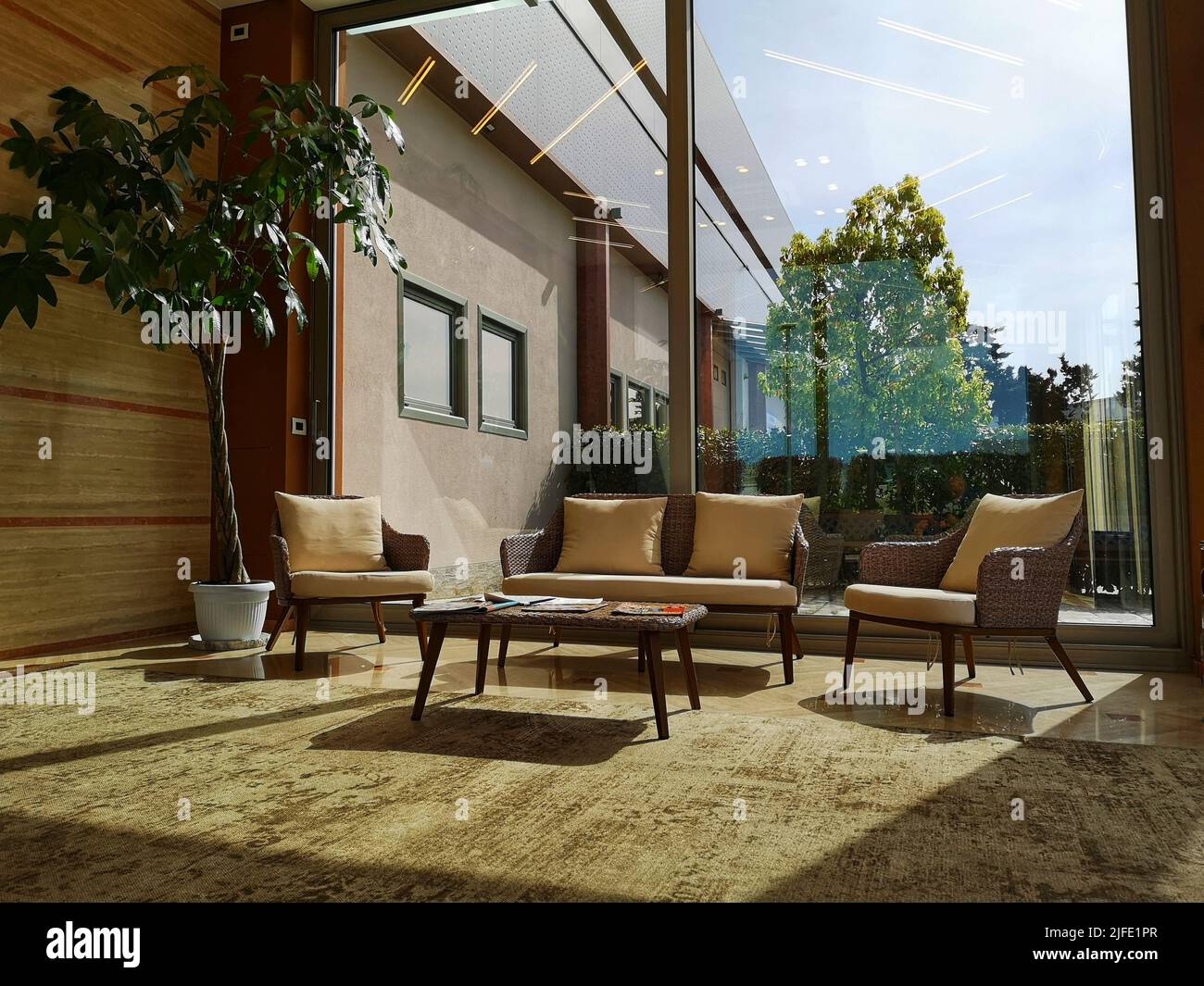 An interior design of a veranda with cozy armchairs and a sofa Stock ...