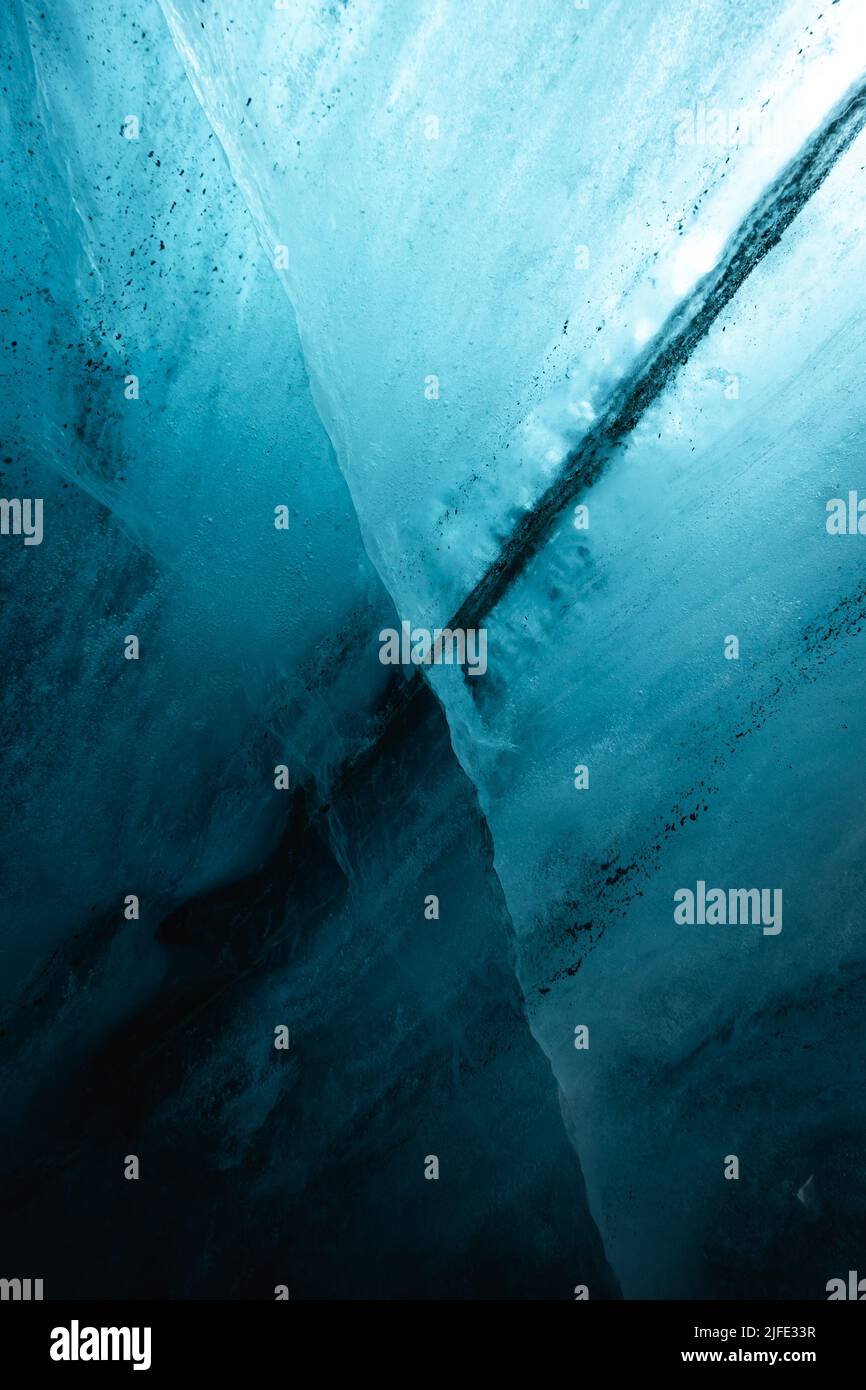 A chilling view of a frozen cave with bright light on the wall Stock ...