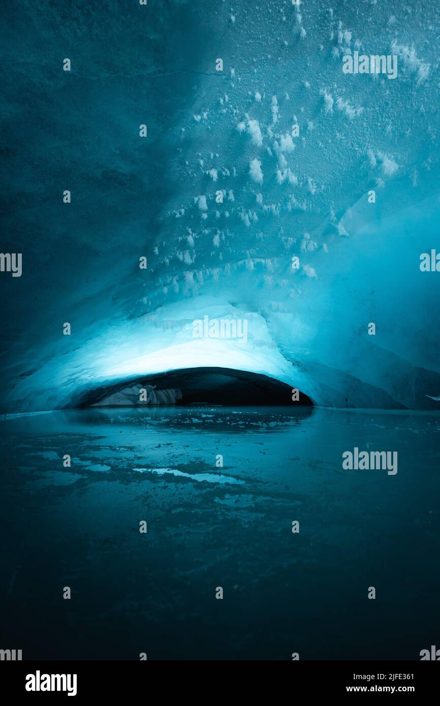 A chilling view of a frozen cave with bright light on the wall Stock ...