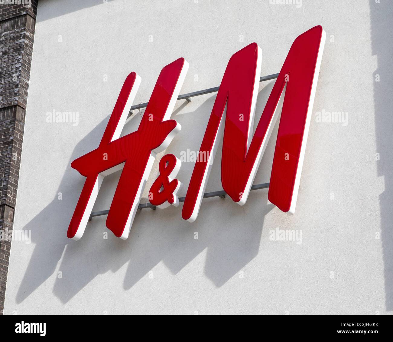 Norfolk, UK - April 8th 2022: Close-up of the H&M logo on the exterior ...