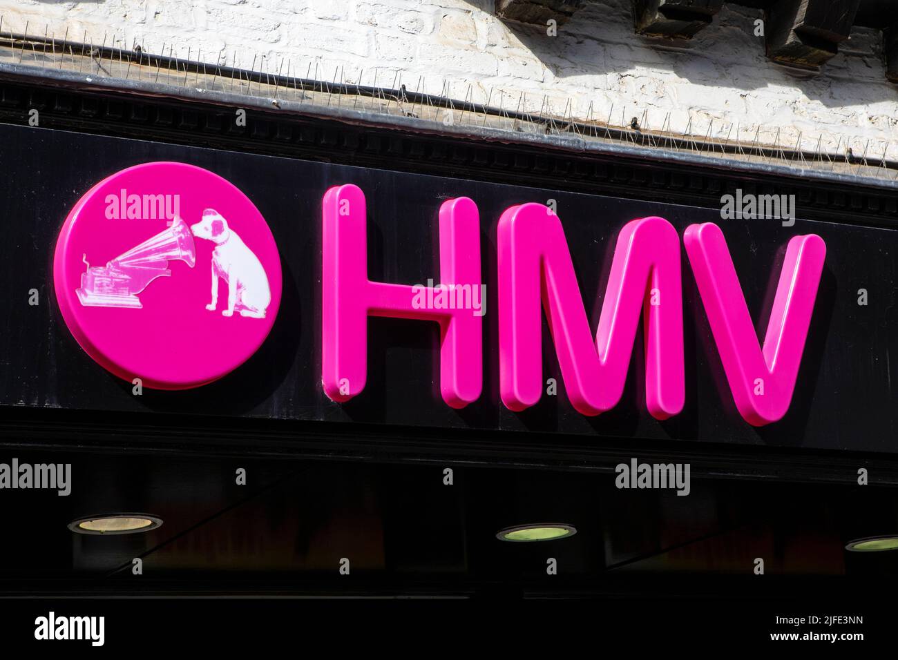Norfolk, UK - April 8th 2022: Close-up of the HMV logo above the ...