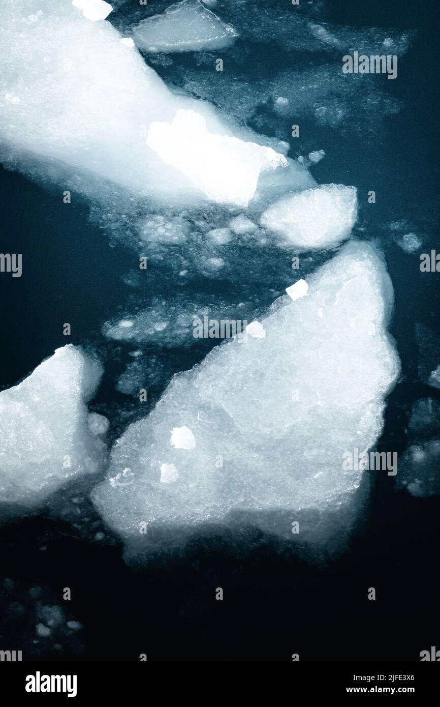 A melting glacier floating on the water surface Stock Photo - Alamy