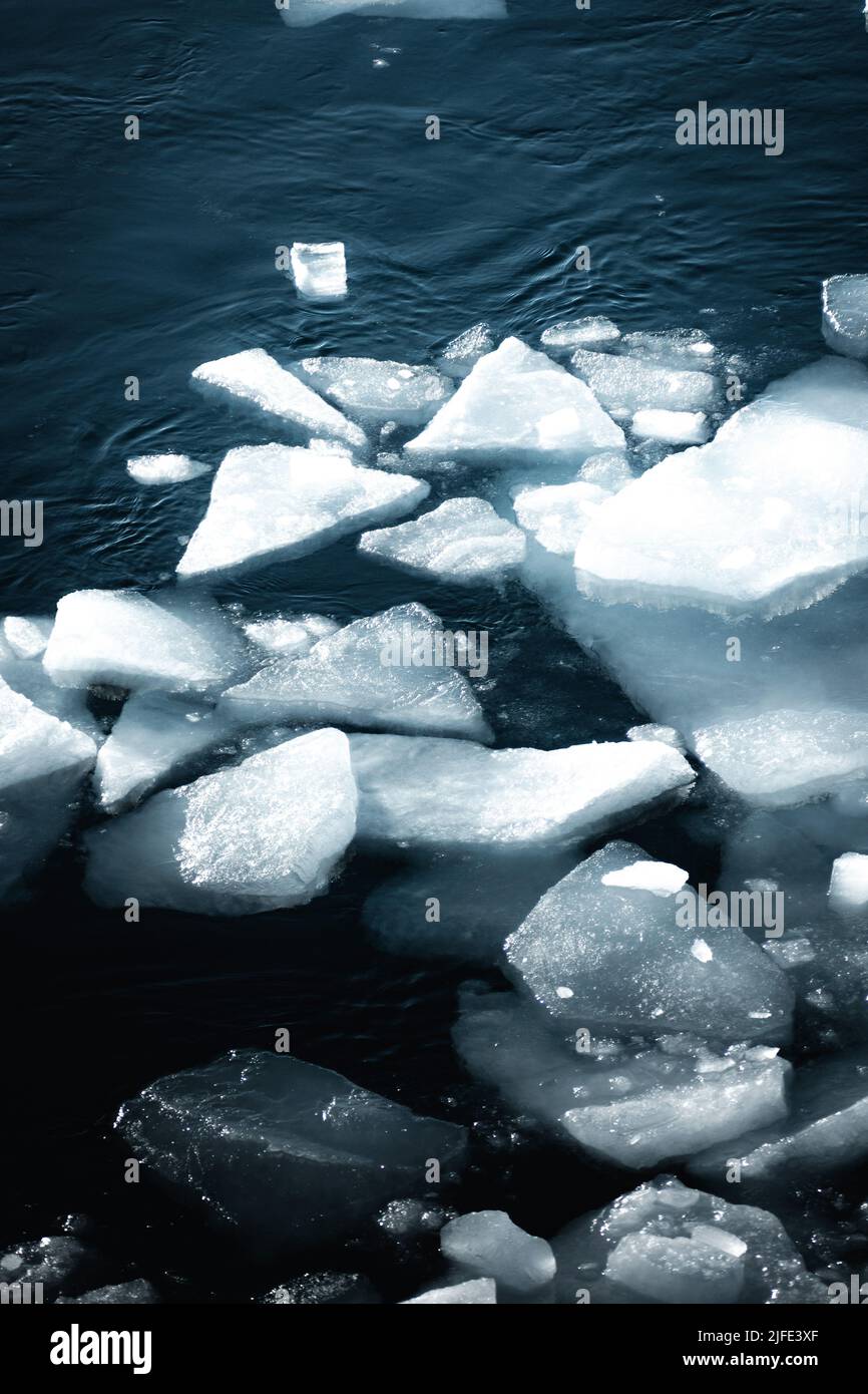 A melting glacier floating on the water surface Stock Photo - Alamy