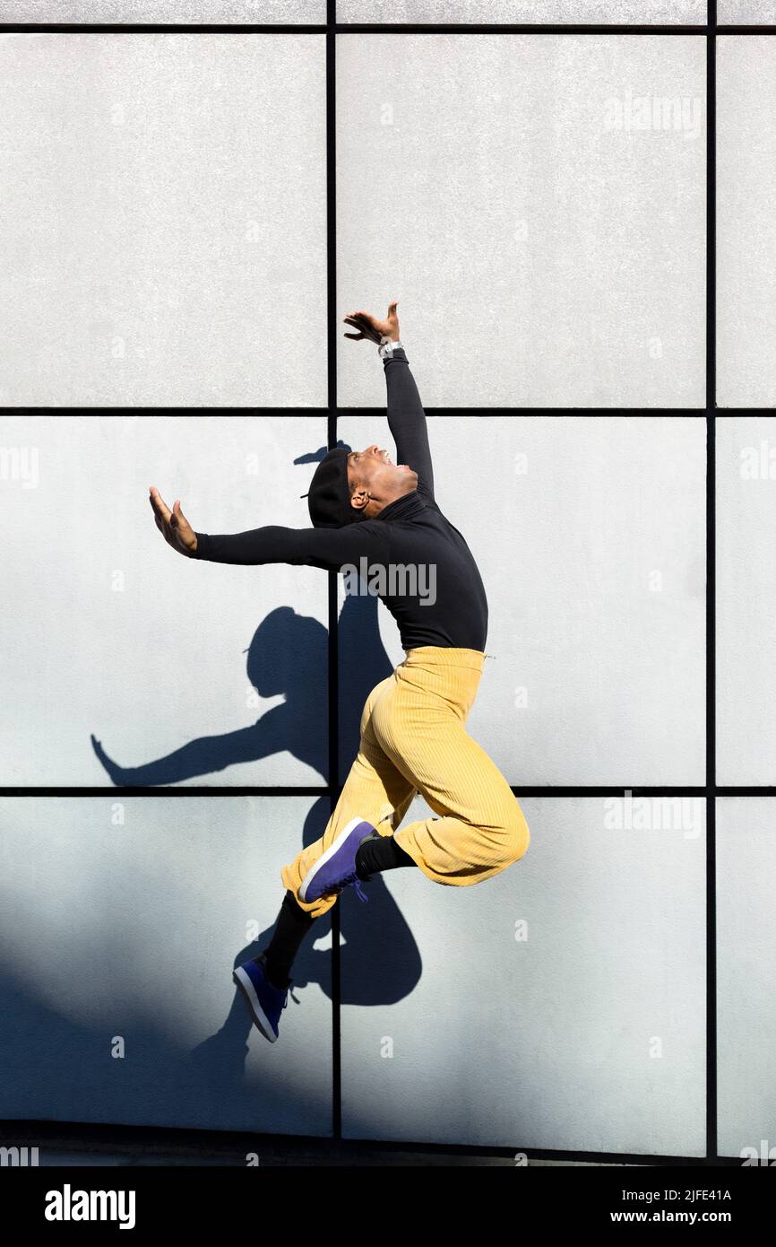 African american male dancer leap hi-res stock photography and images ...