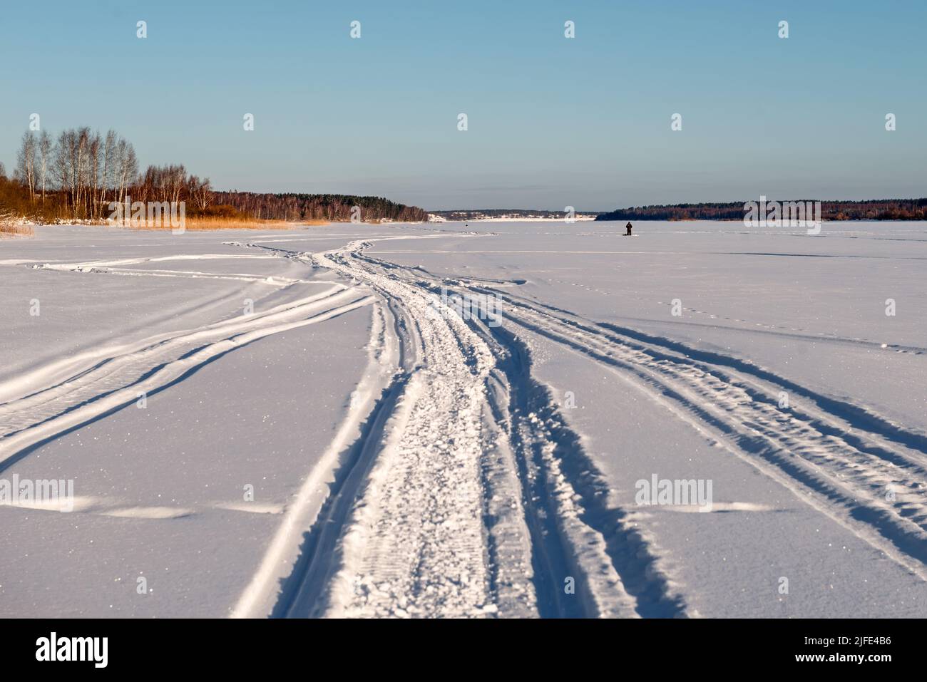 Traces of vehicles and people on the frozen and snow-covered Volga ...