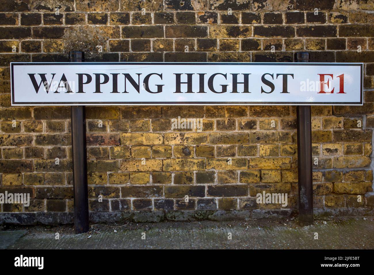 Street sign for Wapping High Street, located In the London Borough of ...