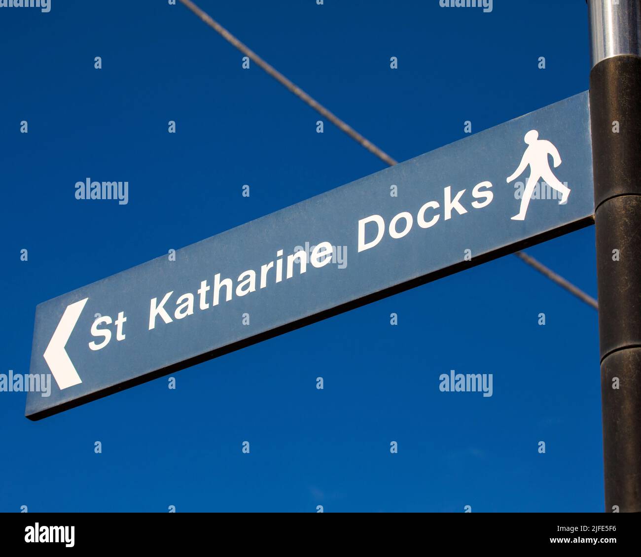 A pedestrian signpost pointing in the direction of St. Katherines Dock ...