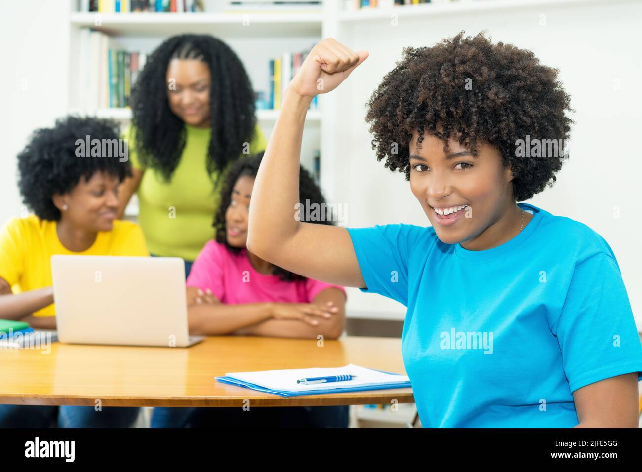 Group of motivated african american computer science students learning ...