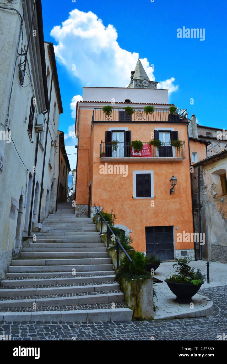 A vertical shot of a narrow, empty street in Fornelli commune in the ...