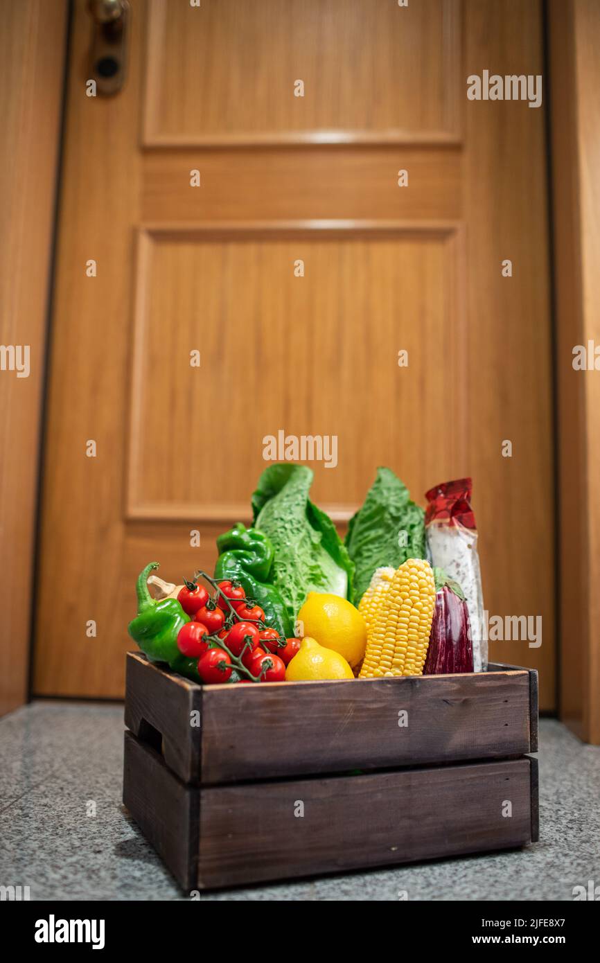 Food shopping box stand at the door of the house or apartment ...