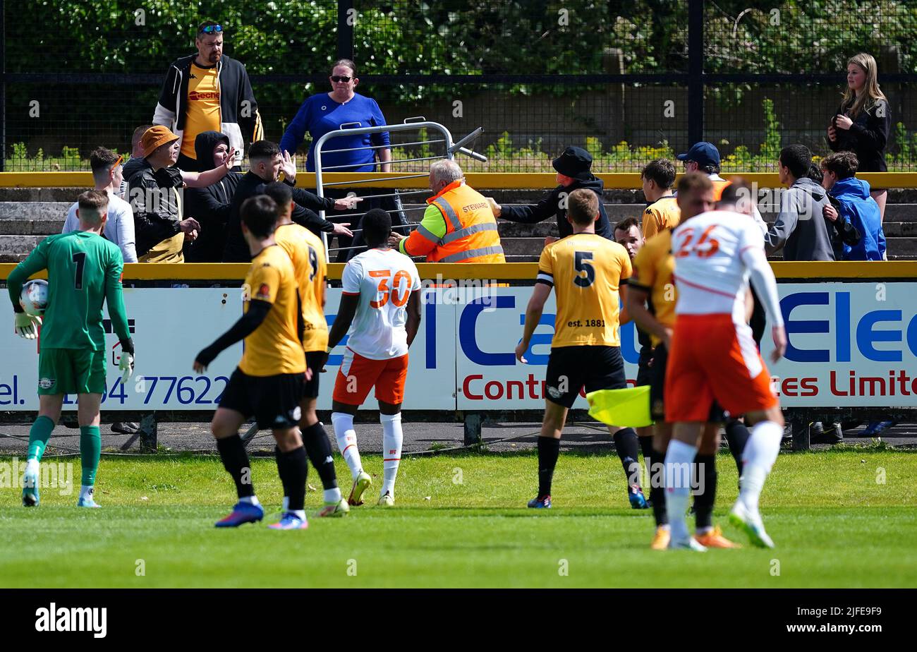Blackpool and Southport fans clash in the stands as the referee is ...