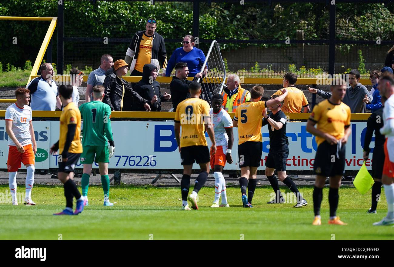 Blackpool and Southport fans clash in the stands as the referee is ...