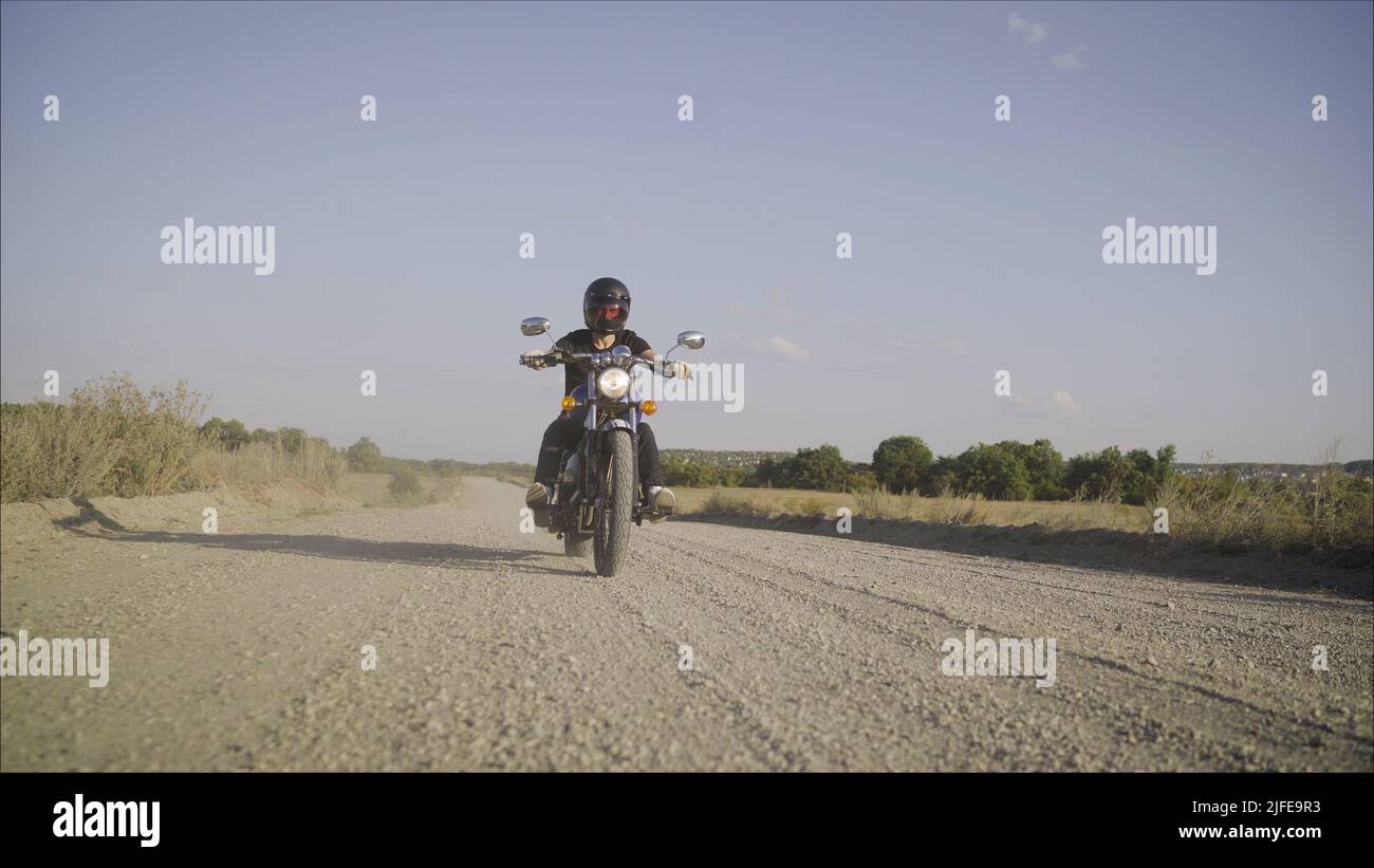custom motorbike on the road riding. having fun driving the empty road ...