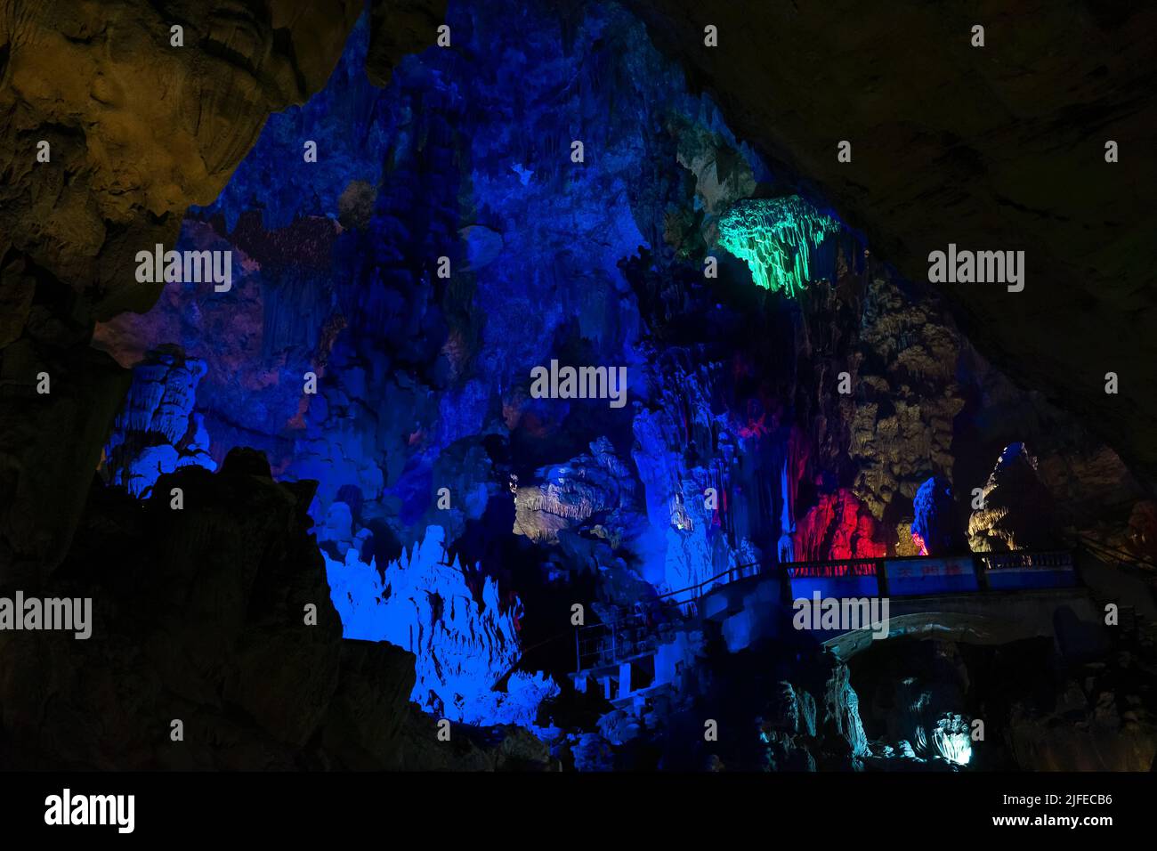 A beautiful view of a cave from inside with colorful lights effect on ...