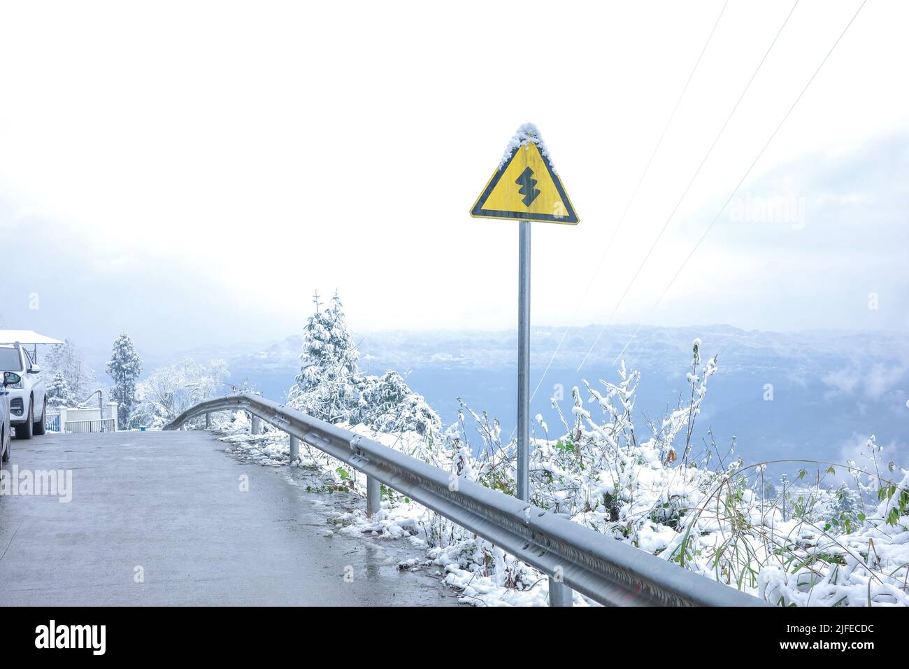 A yellow road sign with frozen plants on a gloomy cold day Stock Photo ...