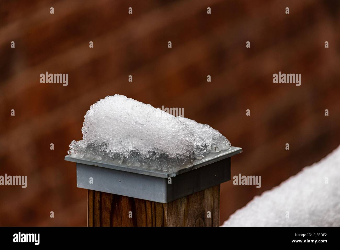 Sitting pretty is a snow blob on a fence cap, Canada Stock Photo - Alamy