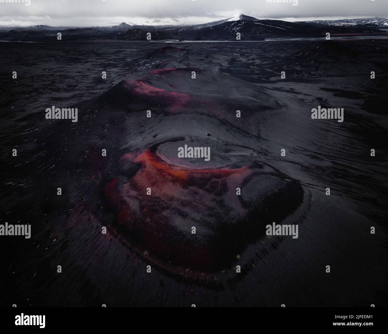 A night view of volcano and hot red lava flowing on its slopes Stock ...