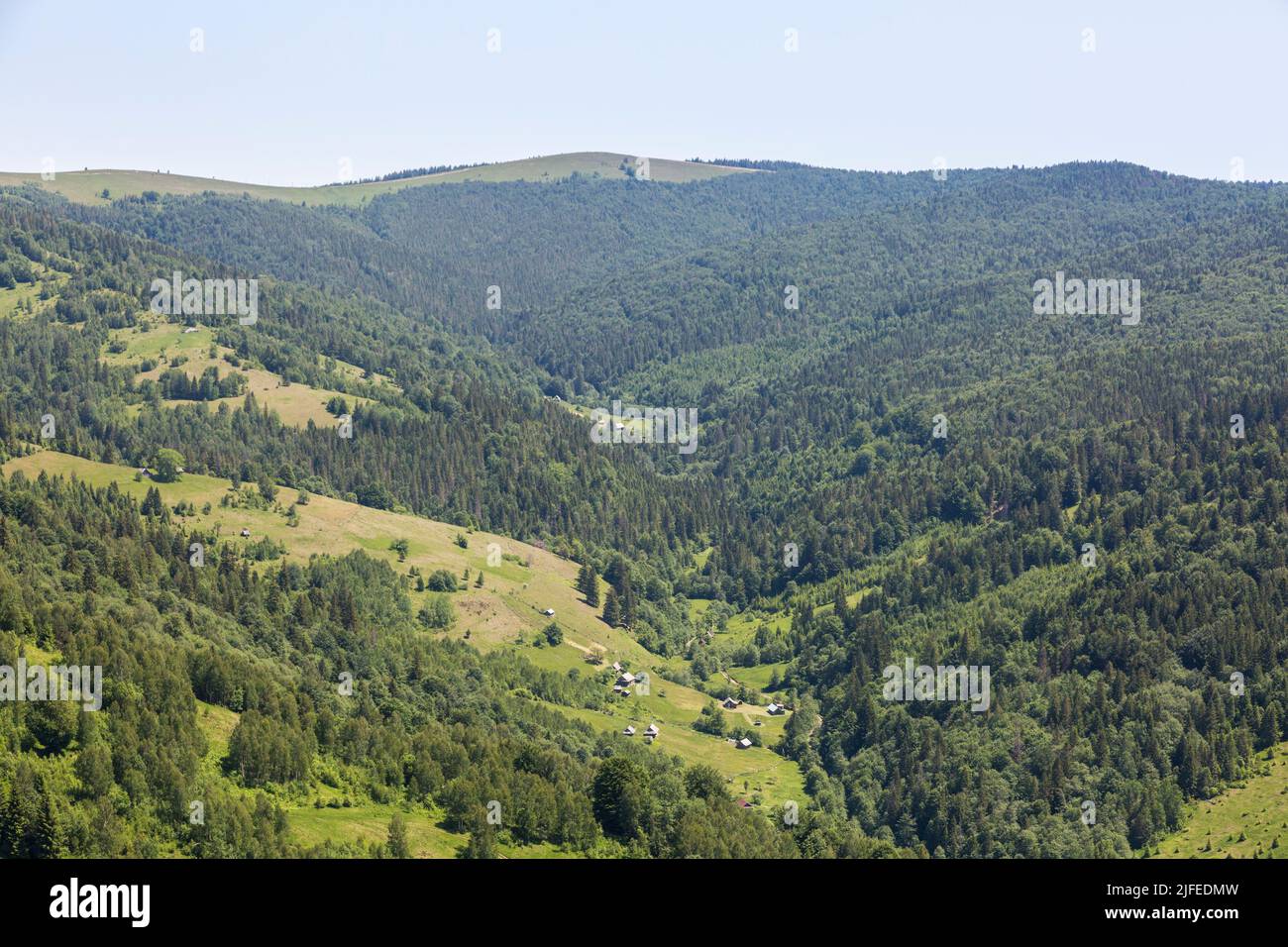 An Aerial landscape of old mountain village between green pines and ...
