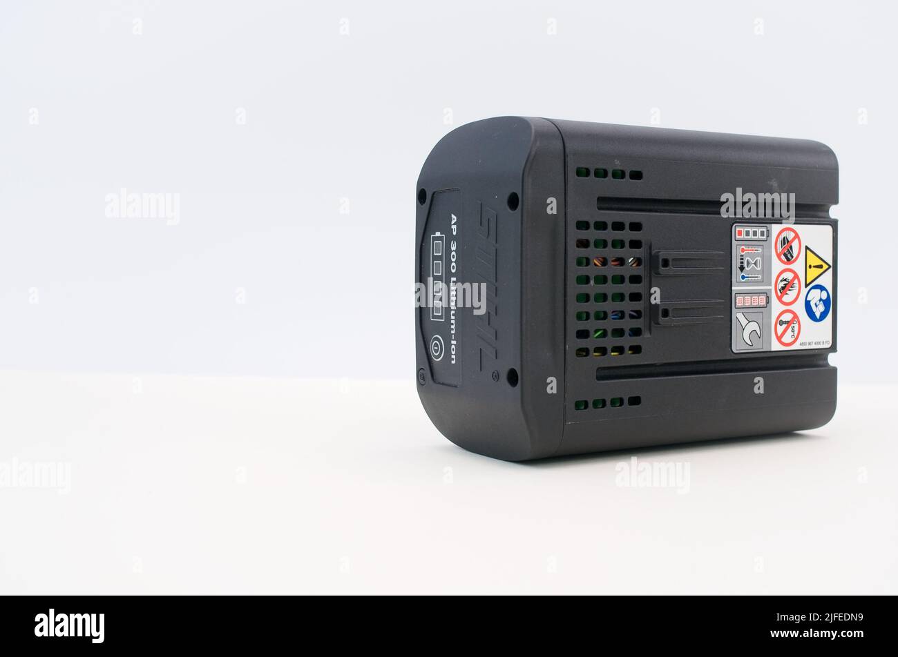 industrial grade high capacity lithium ion battery on a white desk ...