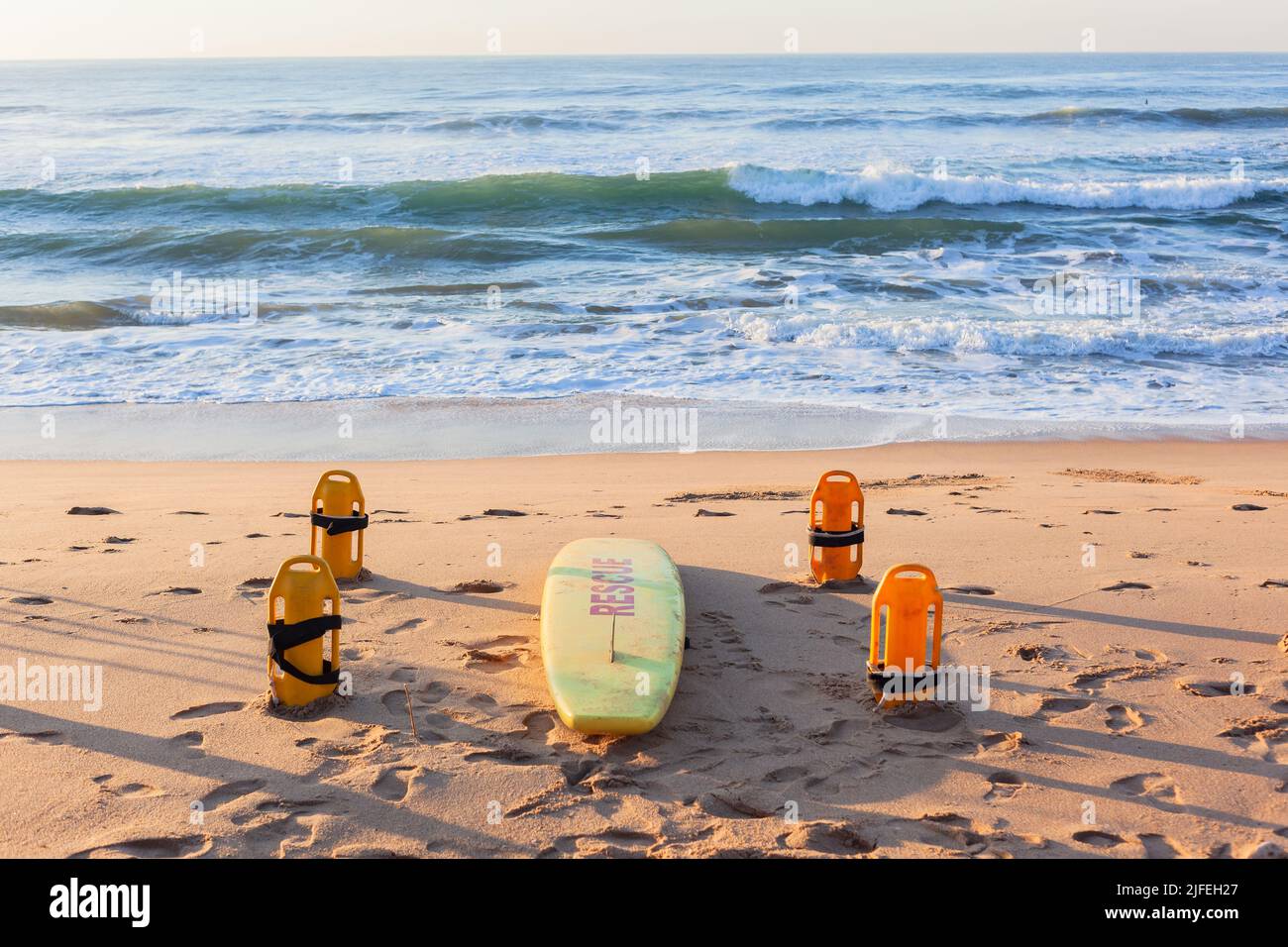 Beach sand ocean lifeguard rescue crafts scenic landscape early morning ...