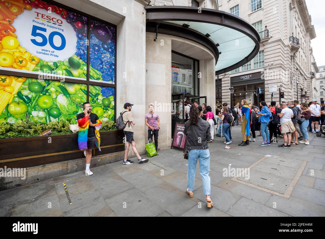 London, UK. 2 July 2022. Large queues outside Tesco (a corporate ...