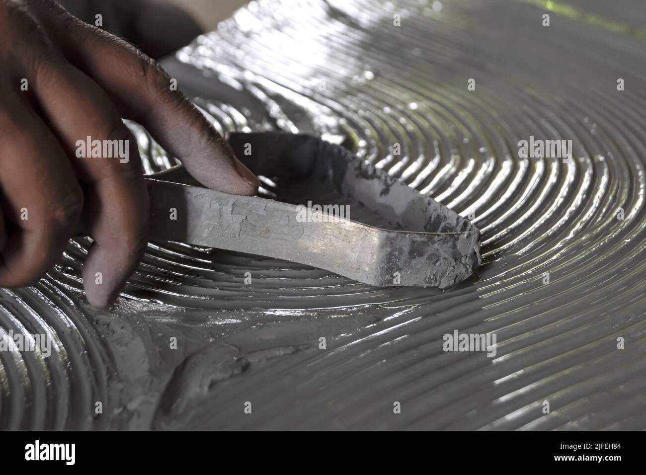 Close up of male sculptor holding tool and making art on clay. Clay ...