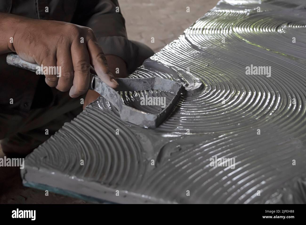 Close up of male sculptor holding tool and making art on clay. Clay ...