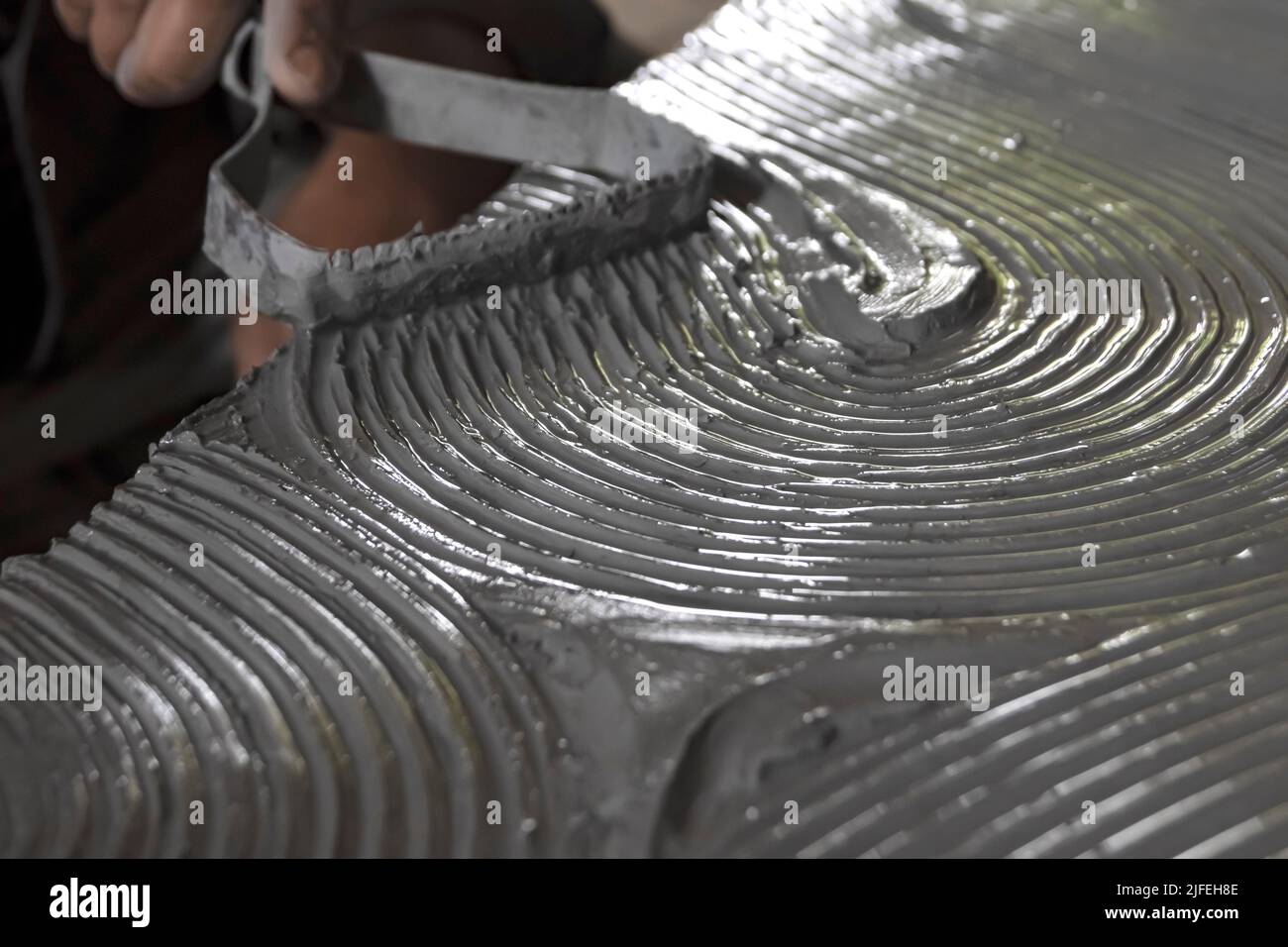 Close up of male sculptor holding tool and making art on clay. Clay ...