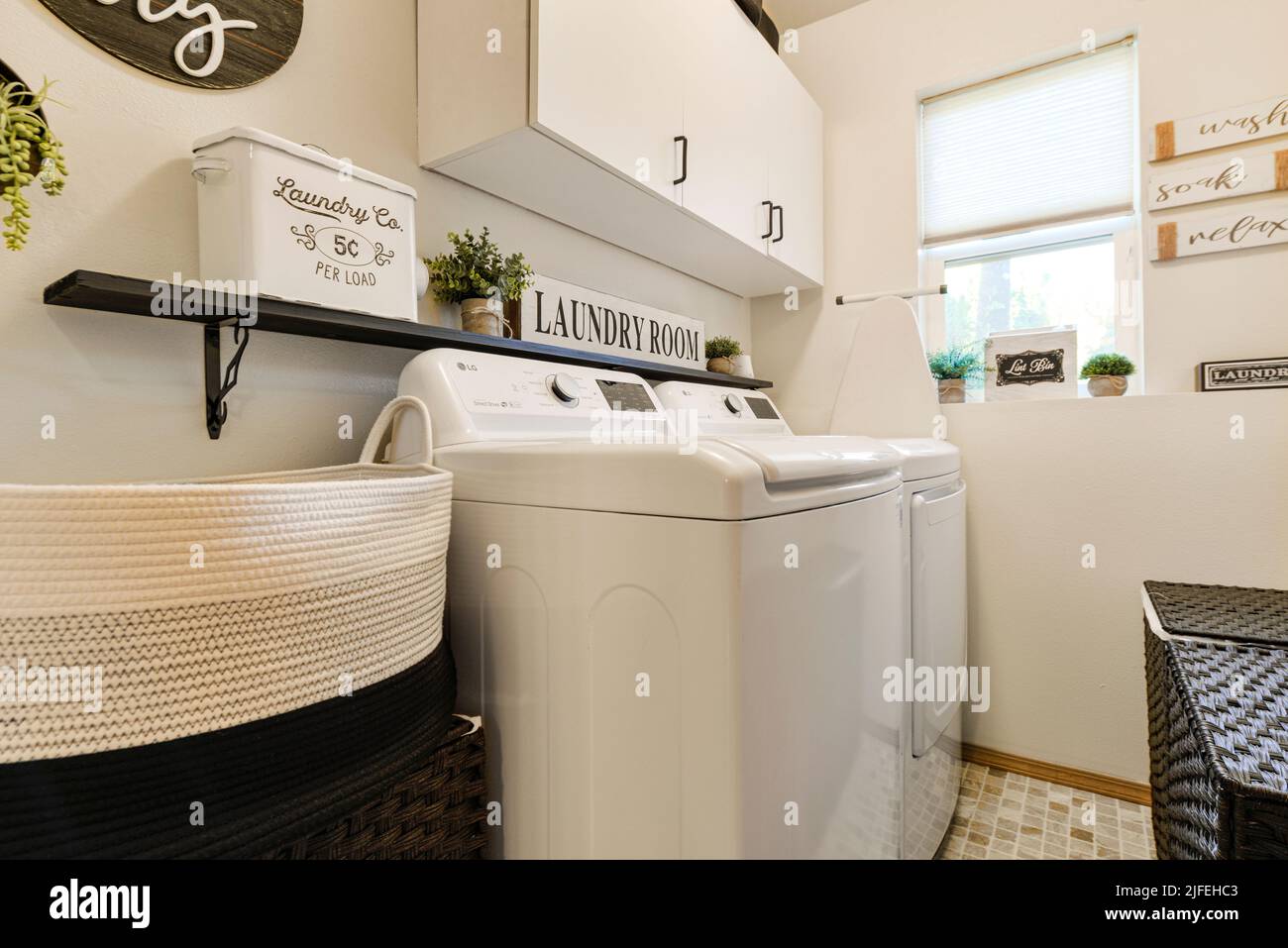Modern residential laundry room interior Stock Photo - Alamy