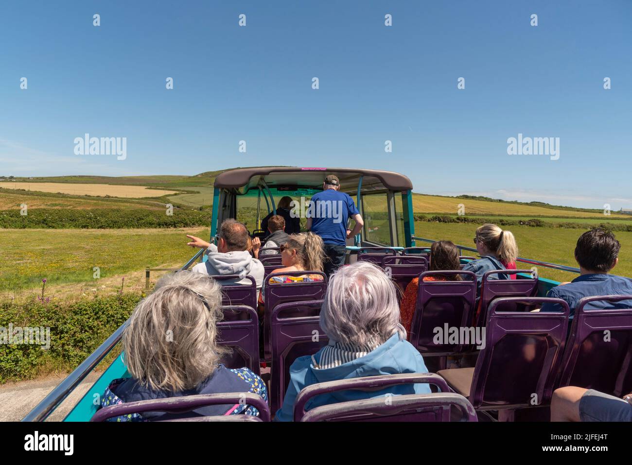 Cornwall, England, UK. 2022. Passengers travelling on a open top ...