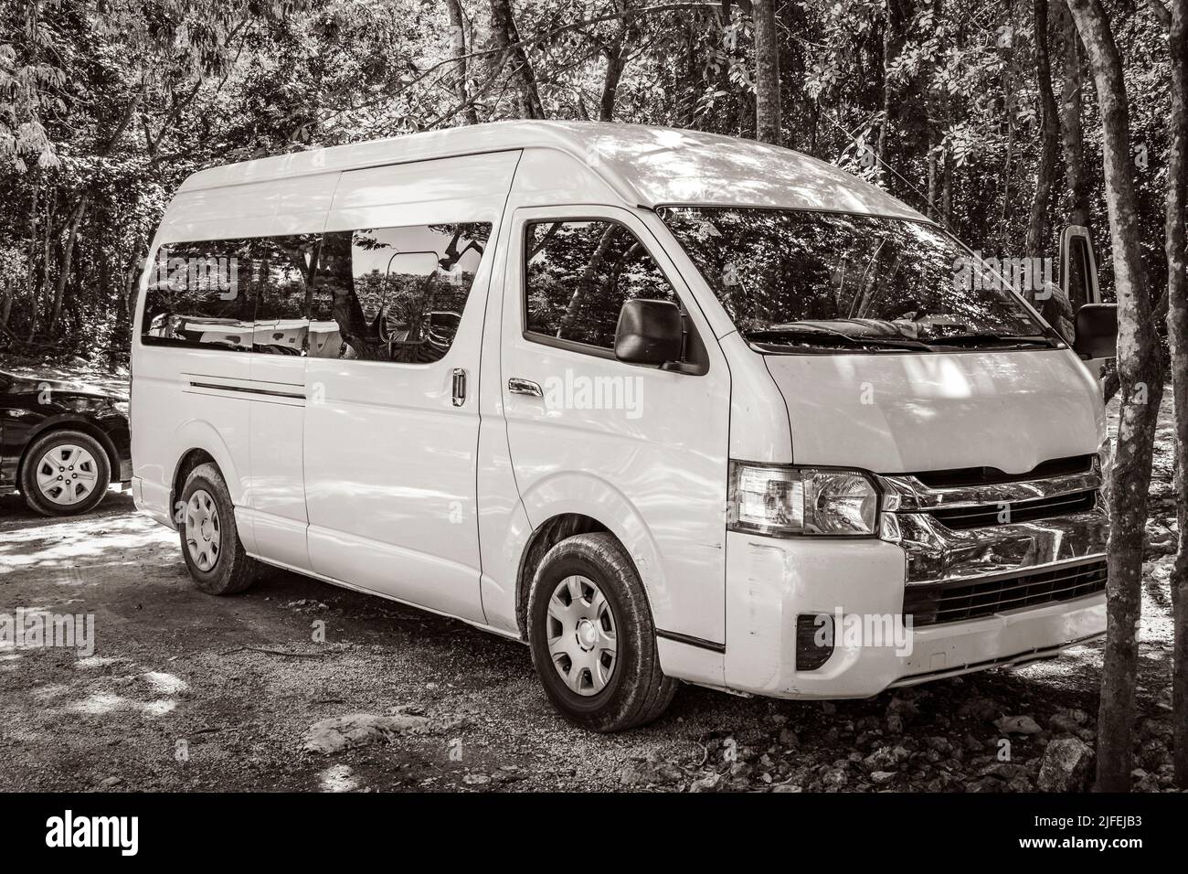 Old black and white picture of White van car taxi in tropical mexican ...