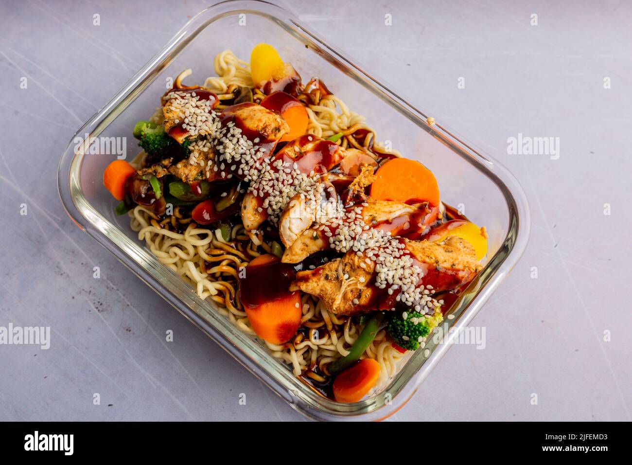 A freshly cooked fried rice with vegetables and fruit toppings on a ...