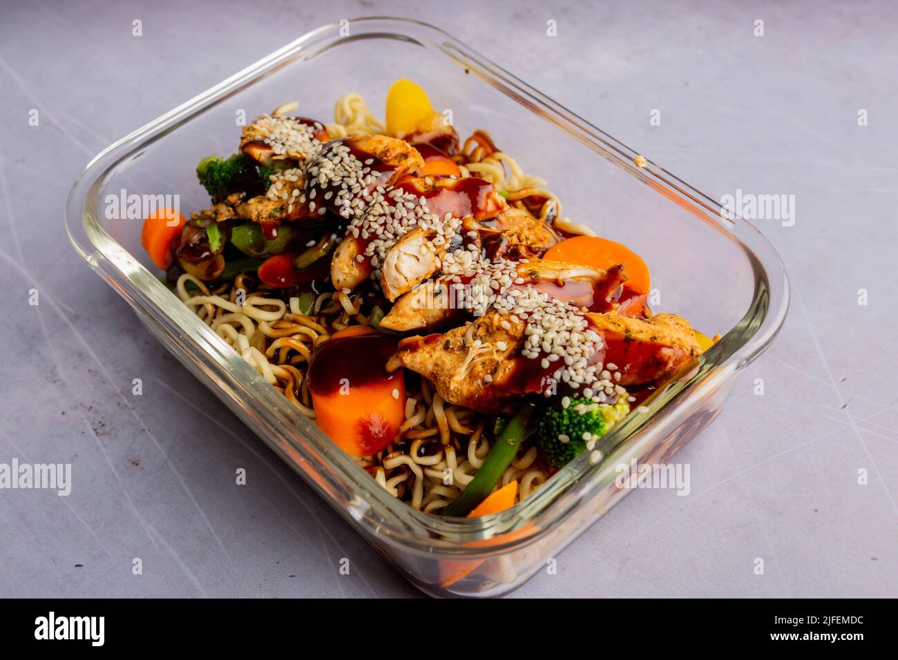 A freshly cooked fried rice with vegetables and fruit toppings on a ...