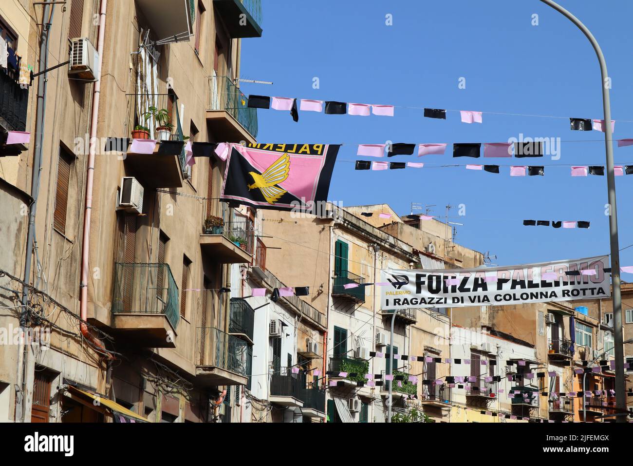 Palermo, Sicily (Italy): scenery of a street of Palermo with flags ...