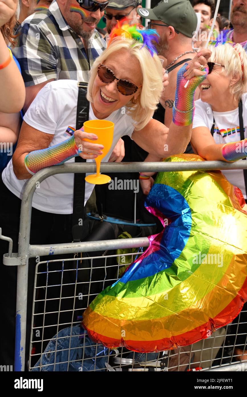 A woman cheers on marchers parading along London's Piccadilly during ...